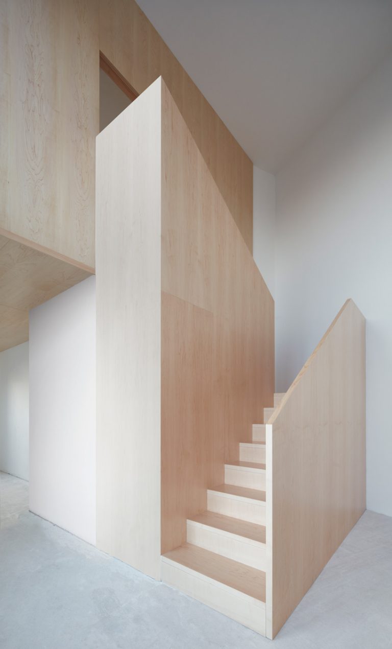 CHYBIK + KRISTOF completes five-story loft building with concrete + ash ...