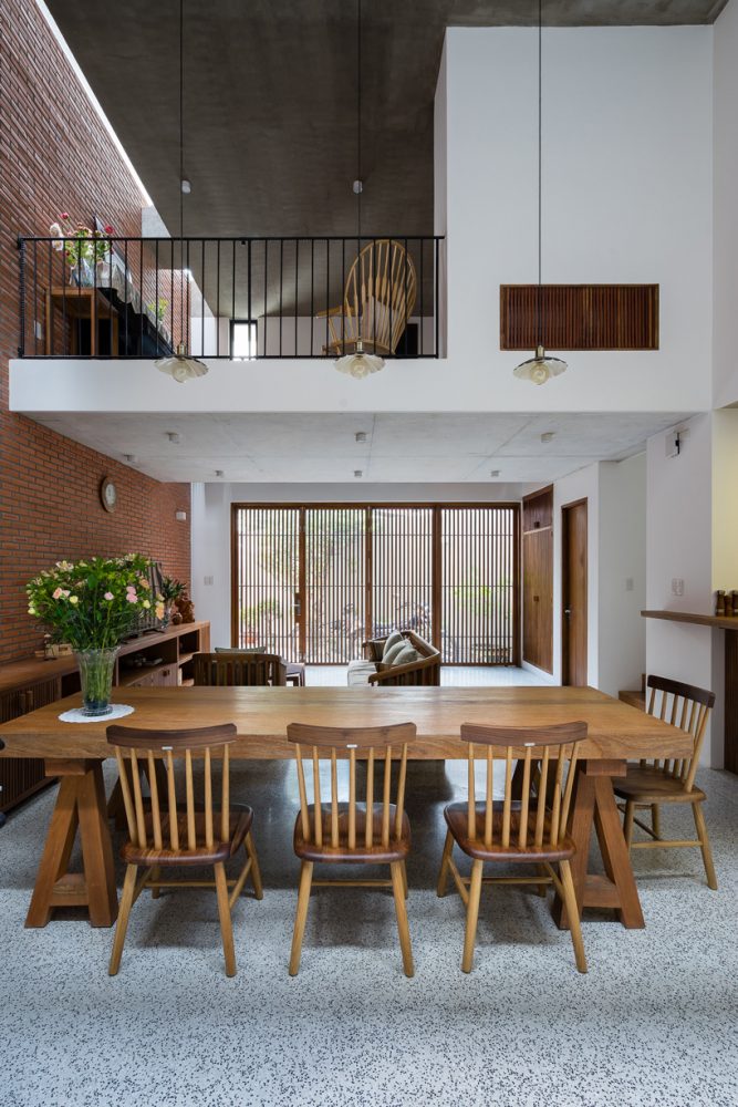 tropical space combines perforated clay brick + concrete for NDC house ...