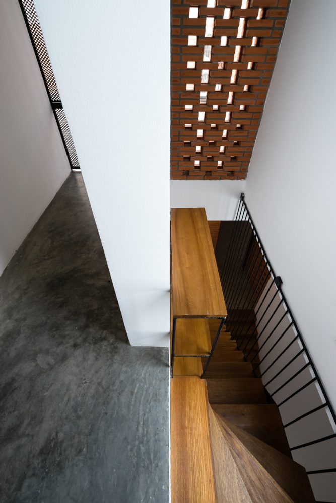 tropical space combines perforated clay brick + concrete for NDC house ...