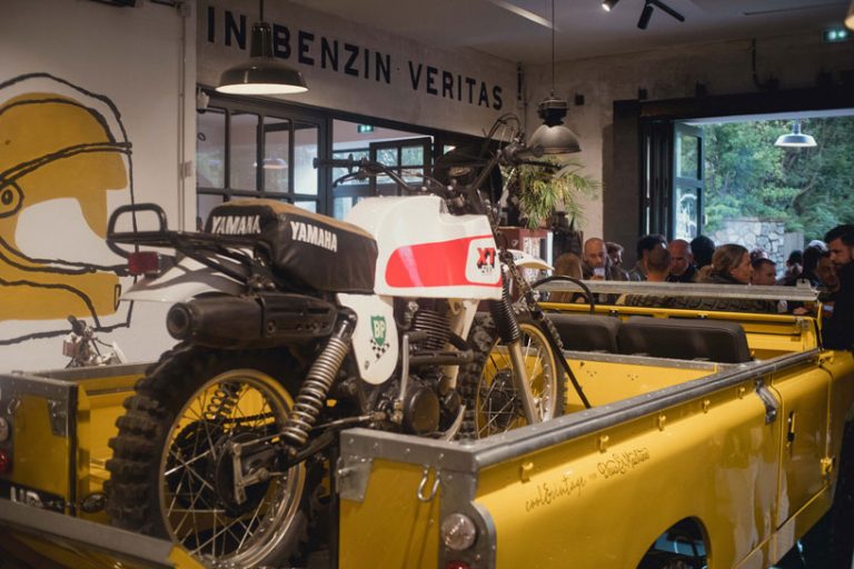 coolnvintage and deus ex-machina present a motorcycle hauling land rover