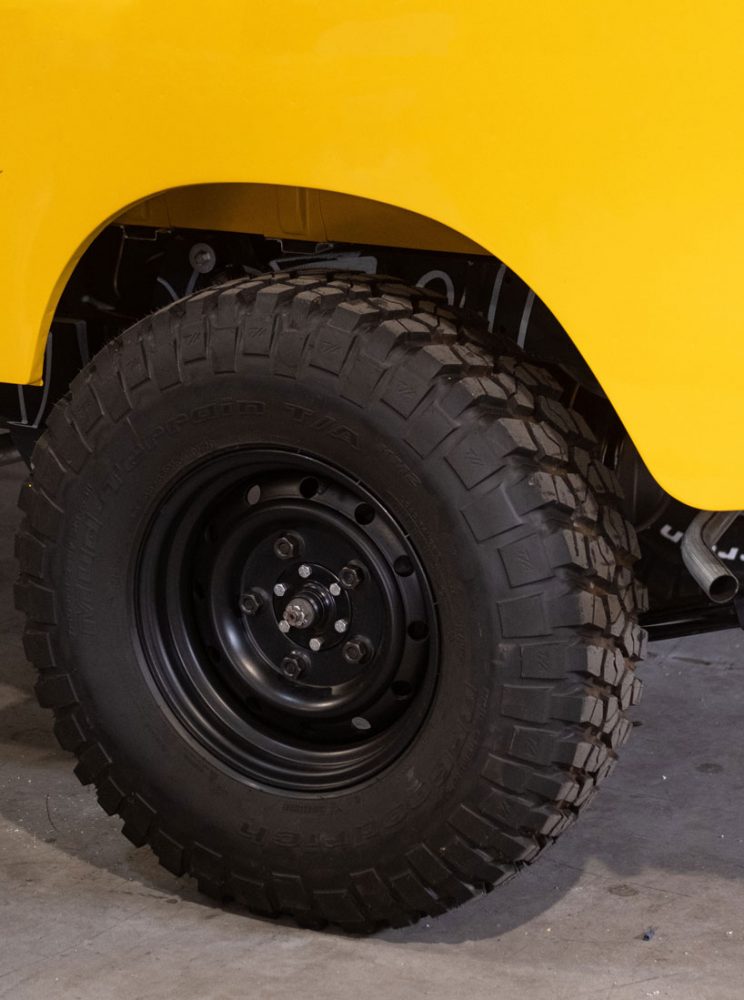 coolnvintage and deus ex-machina present a motorcycle hauling land rover