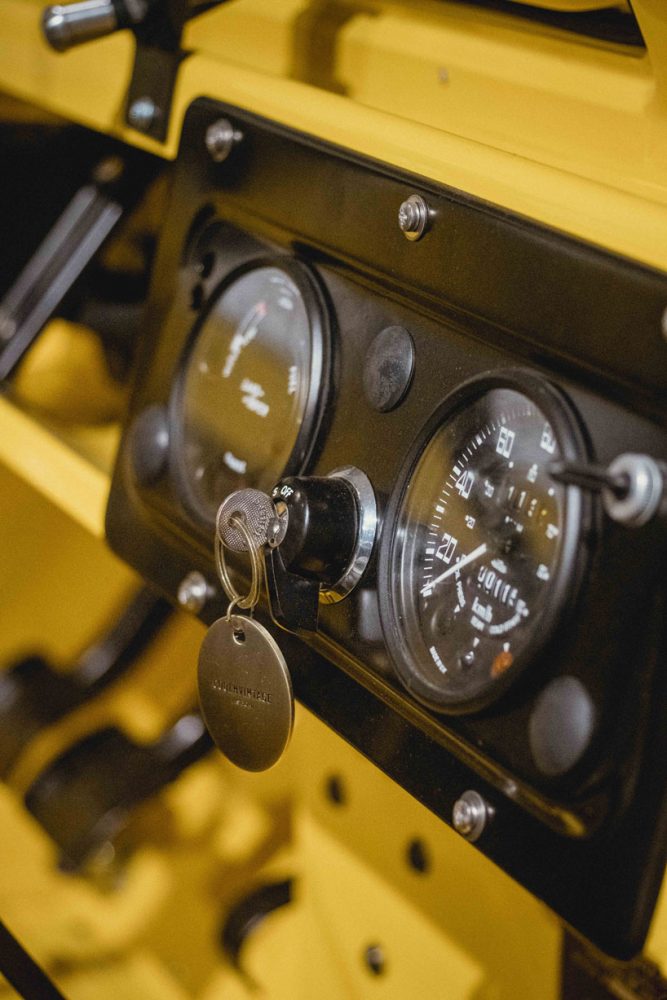 coolnvintage and deus ex-machina present a motorcycle hauling land rover