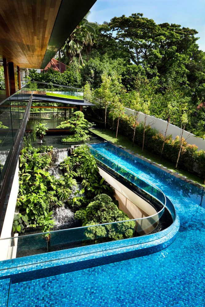 guz architects cantilevers the botanica house over nature in singapore