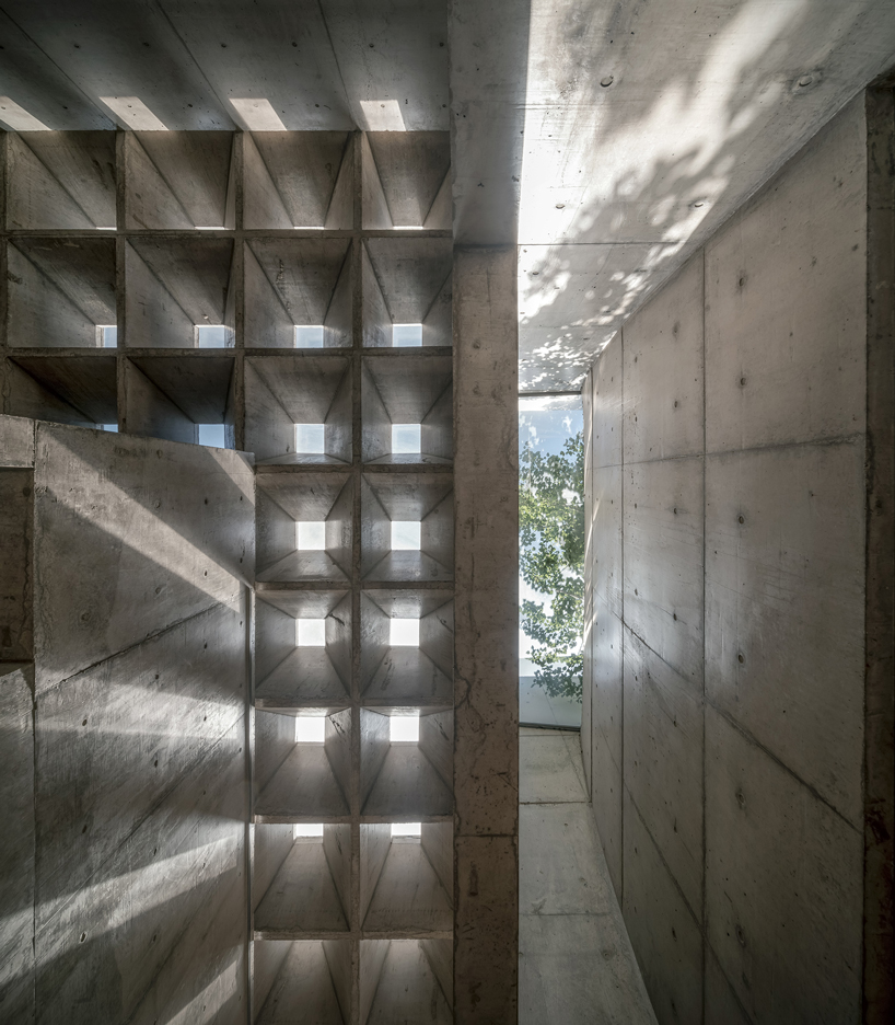 concrete waffle beams bring light into vector architects' restaurant in ...