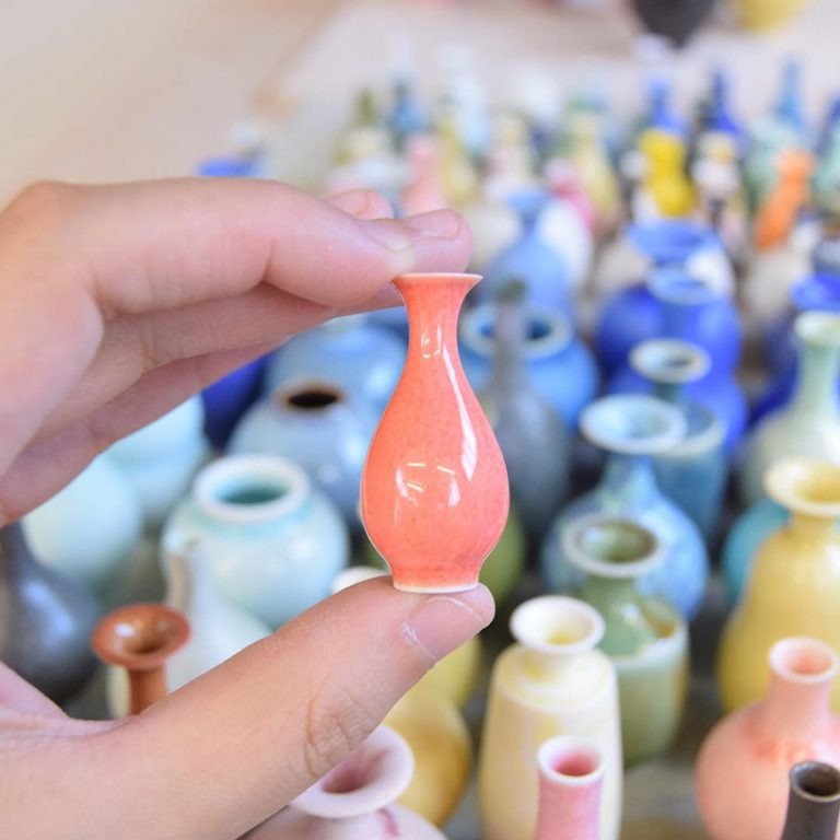 artist yuta segawa hand-throws thousands of tiny ceramic vases