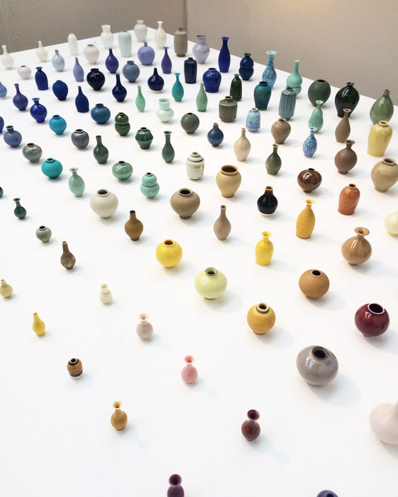 artist yuta segawa hand-throws thousands of tiny ceramic vases