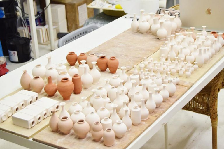 artist yuta segawa hand-throws thousands of tiny ceramic vases