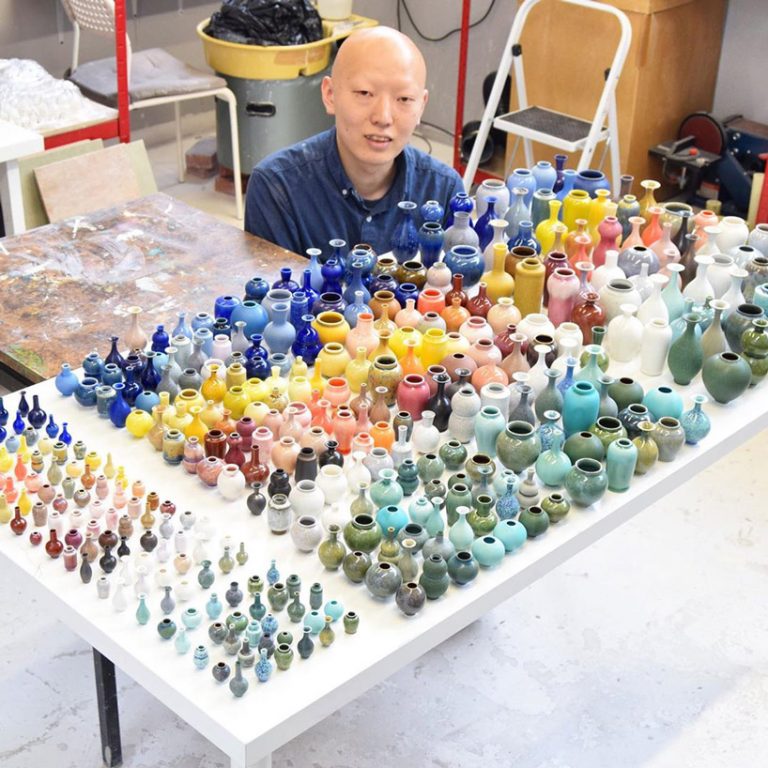 artist yuta segawa hand-throws thousands of tiny ceramic vases