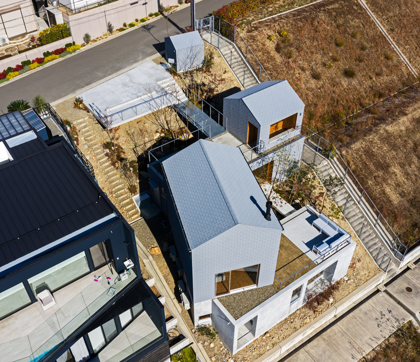 geo-graphic design lab stacks huts on a slope for family residence in ...