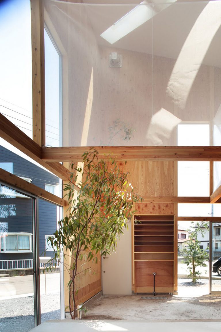 ikimono architects divides areas of this japanese house using a wooden grid