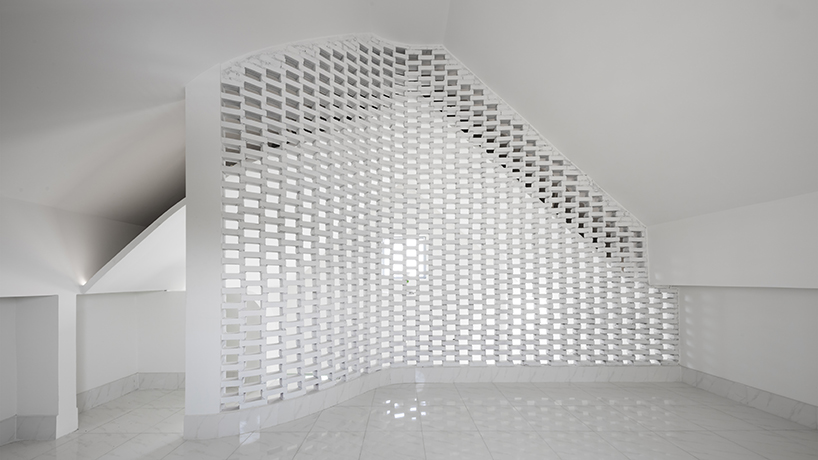 time architects builds vietnam house for 3 families with open living spaces