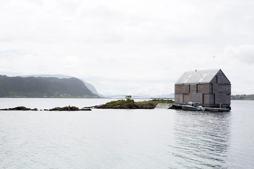 knut hjeltnes builds timber weekend house on a norwegian islet of its own