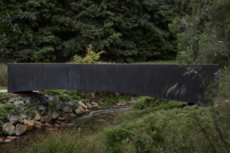 czech cemetery bridge fabricated of ultra-lightweight black concrete