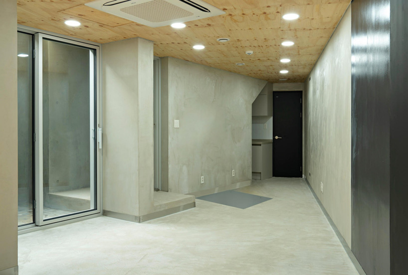 architects H2L builds concrete slit house on a triangular lot in south ...