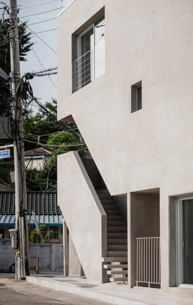 architects H2L builds concrete slit house on a triangular lot in south ...