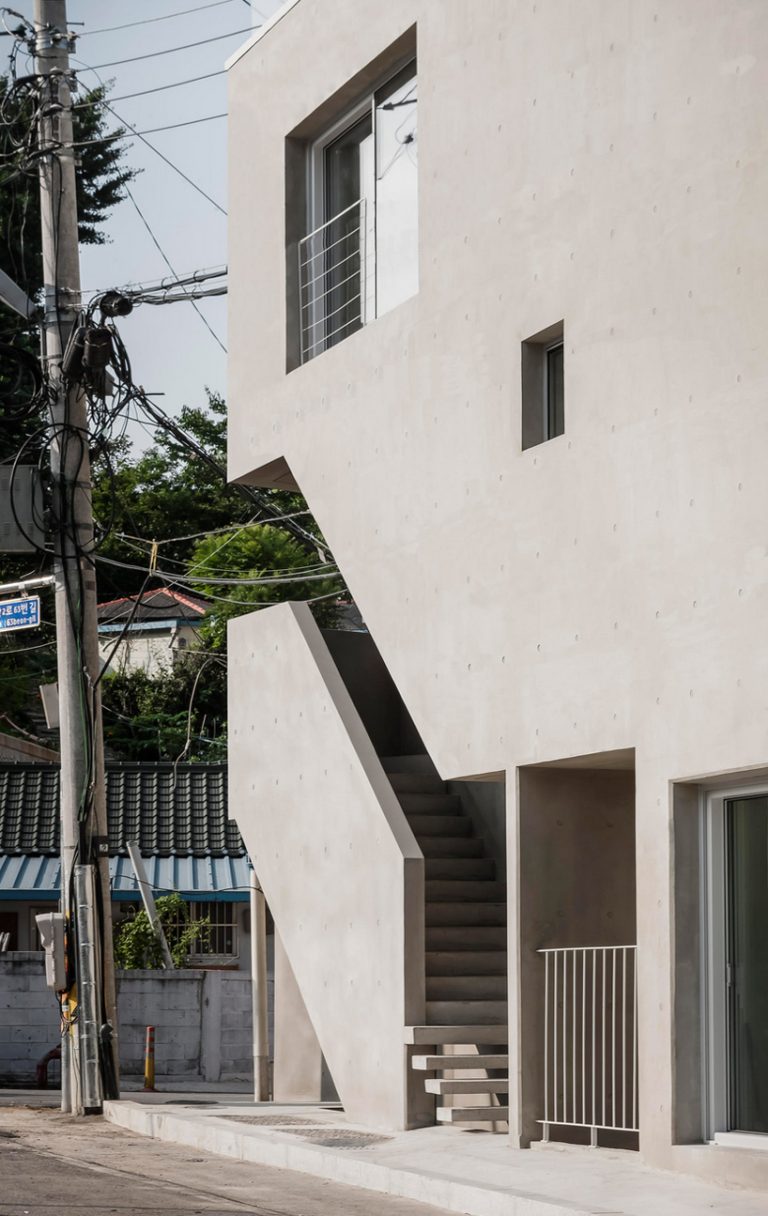 architects H2L builds concrete slit house on a triangular lot in south ...