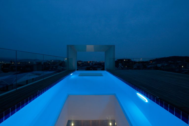 EASTERN design office stacks concrete square tubes for house in kyoto