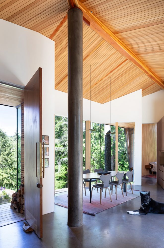 campos studio embeds the sooke house within the forest of a rocky hill ...