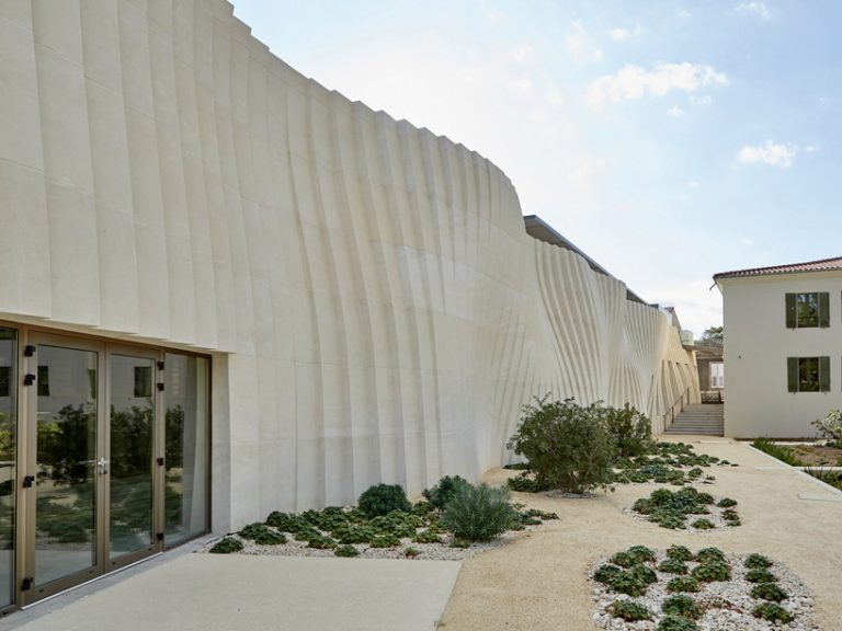 carl fredrik svenstedt adds cellar clad in curving solid stone to delas ...