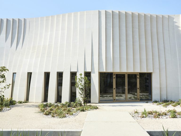 carl fredrik svenstedt adds cellar clad in curving solid stone to delas ...