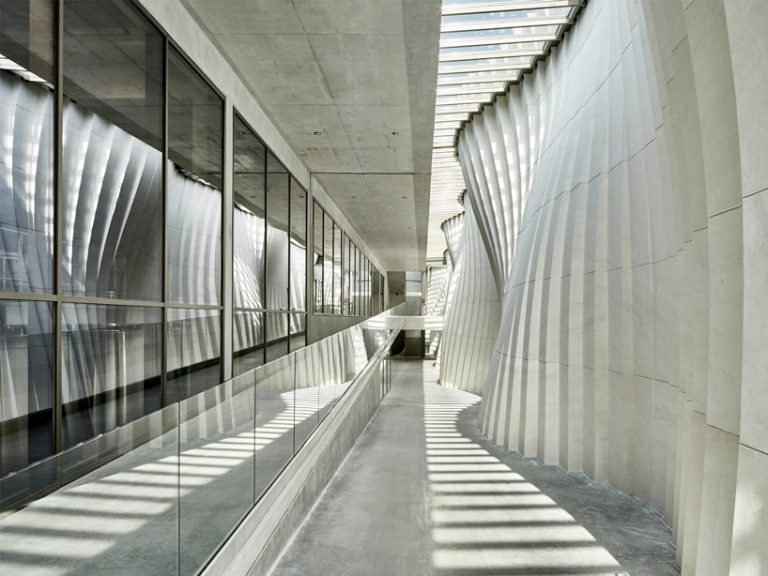 carl fredrik svenstedt adds cellar clad in curving solid stone to delas ...