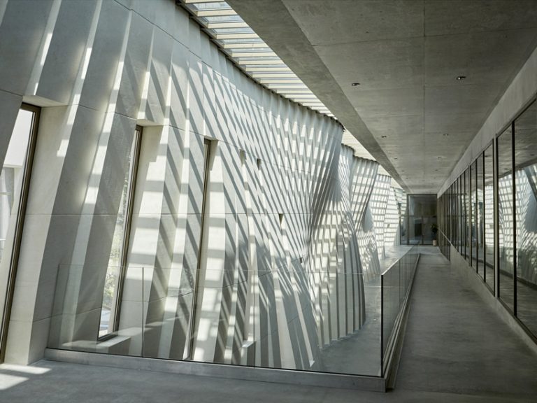 carl fredrik svenstedt adds cellar clad in curving solid stone to delas ...