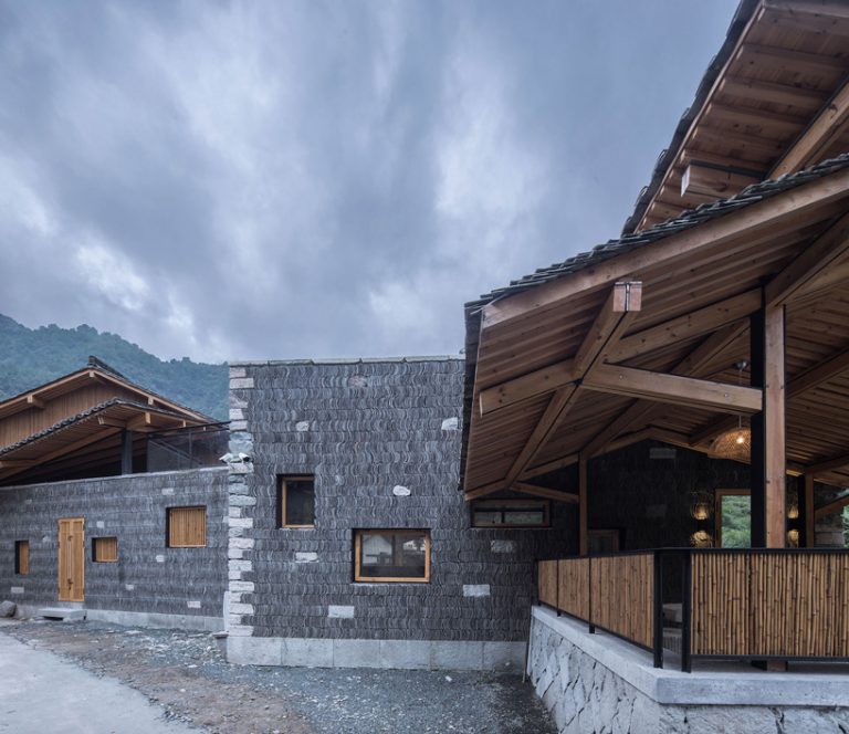 shulin architectural design sets stone + wood hotel within an ancient ...