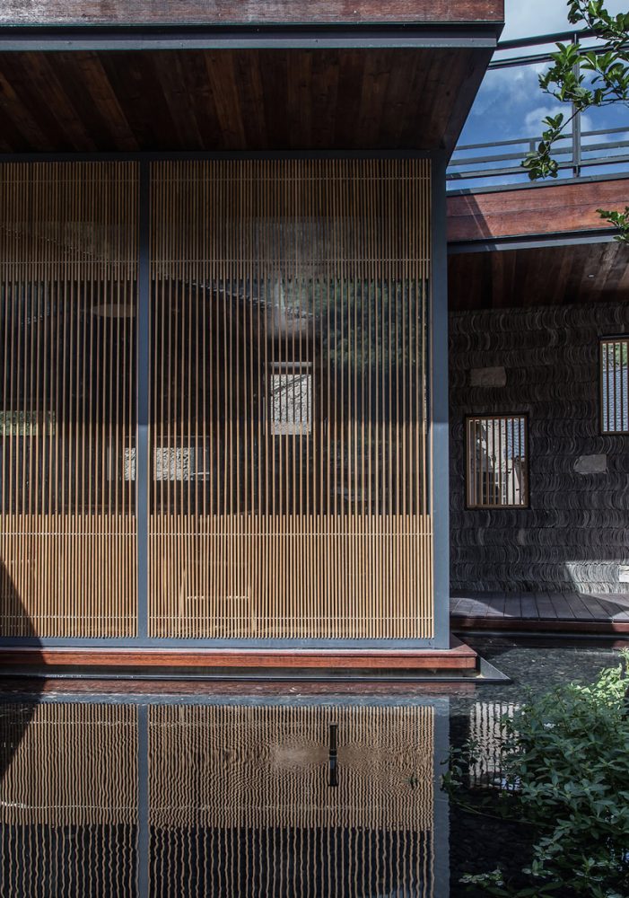 shulin architectural design sets stone + wood hotel within an ancient ...