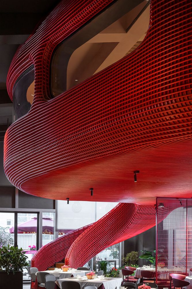 red rattan metal wraps around a restaurant in chengdu designed by IN • X