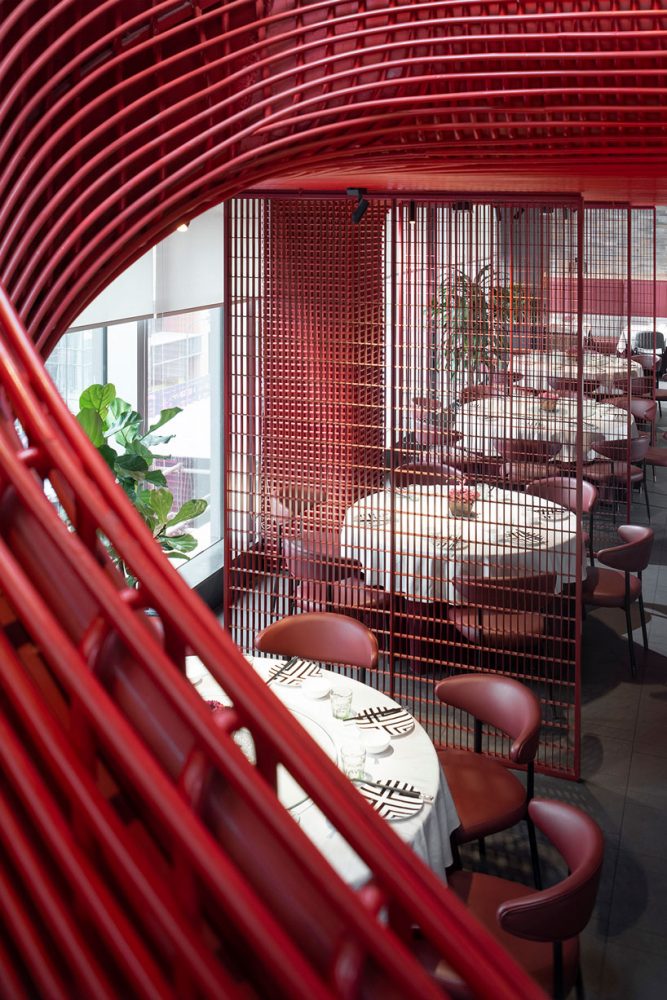 red rattan metal wraps around a restaurant in chengdu designed by IN • X