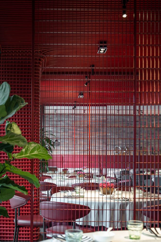 red rattan metal wraps around a restaurant in chengdu designed by IN • X