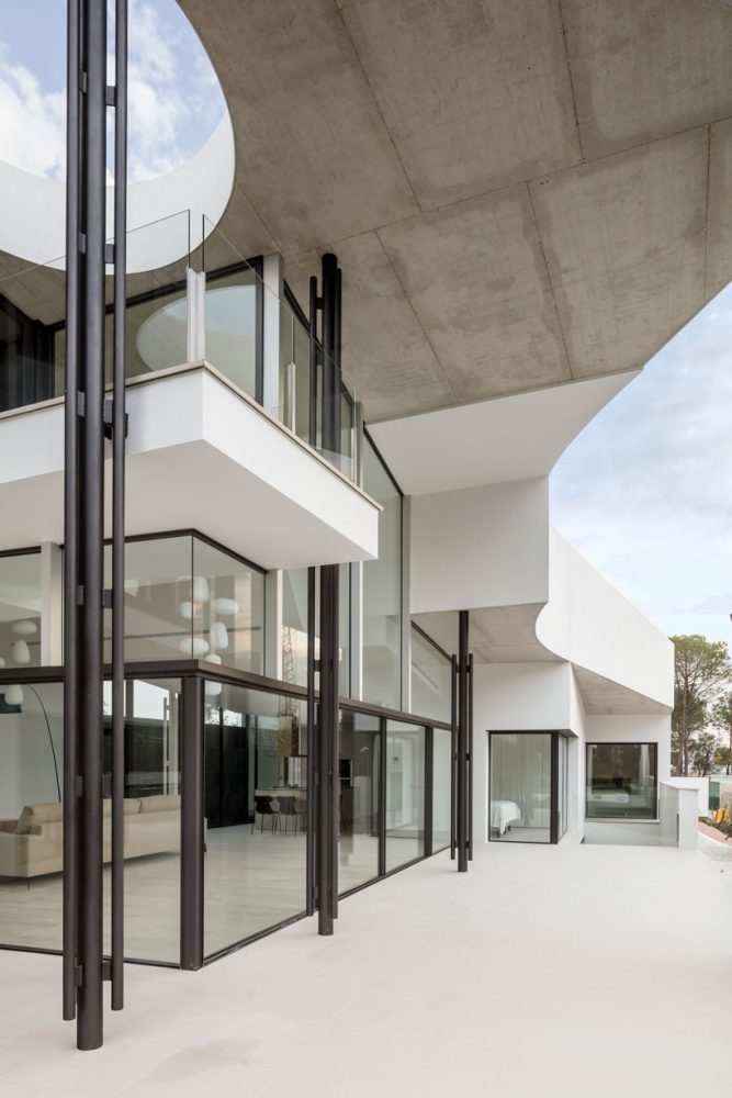 lagula arquitectes designs 'gruyere house' to optimize privacy in girona