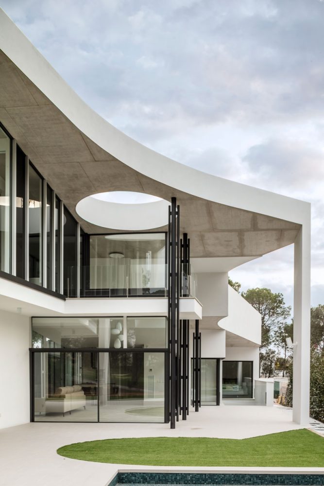 lagula arquitectes designs 'gruyere house' to optimize privacy in girona