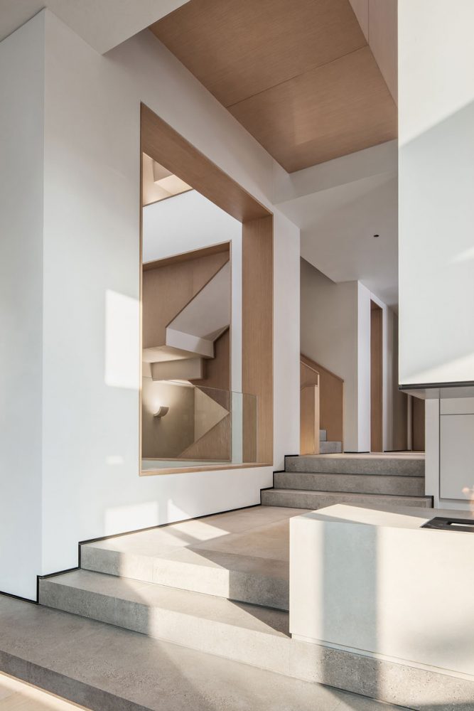 liang architecture inserts a light-filled atrium into apartment in china