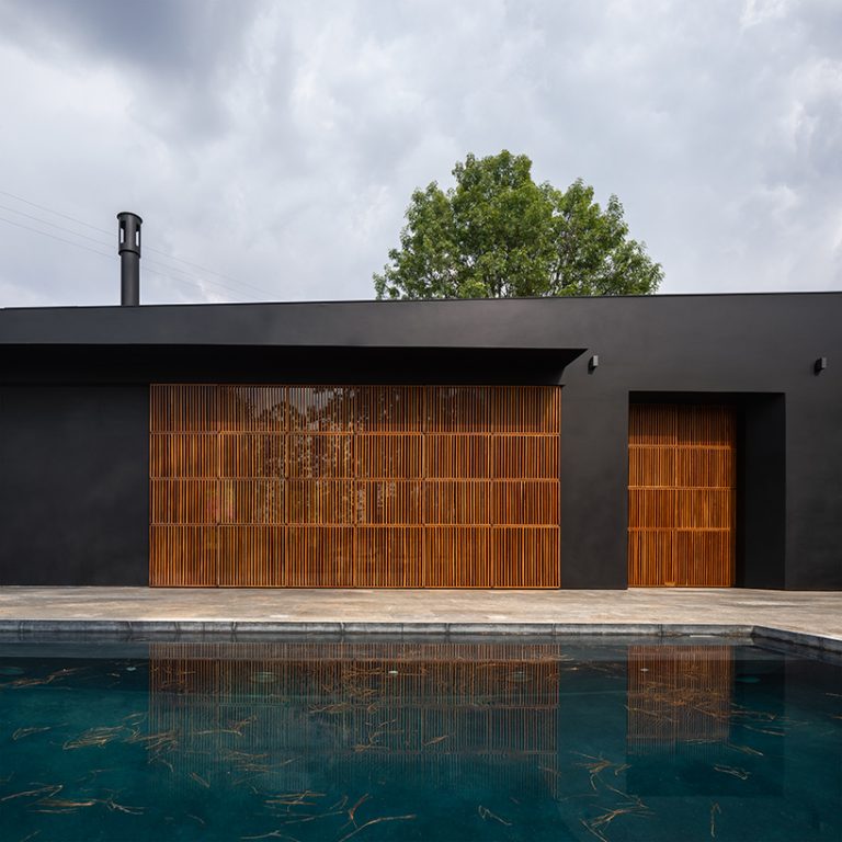 PPAA designs 'las golondrinas' with matte black and timber geometries