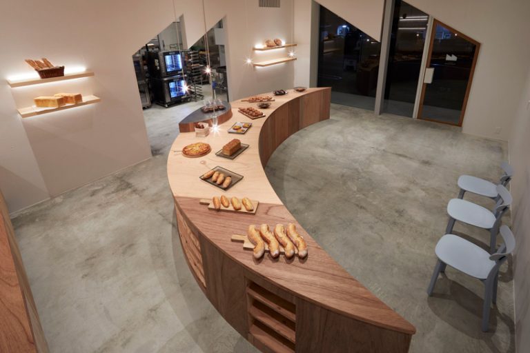 airhouse completes 'bakery tsukiakari' in japan with half-moon counter