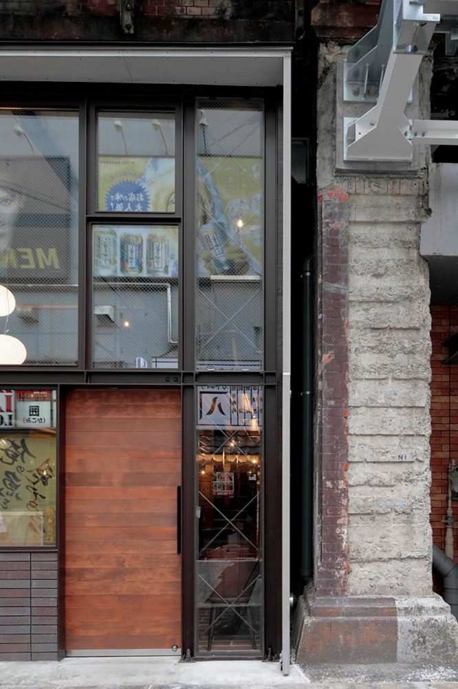steel H-beams build coffee shop situated under railway elevated bridge ...
