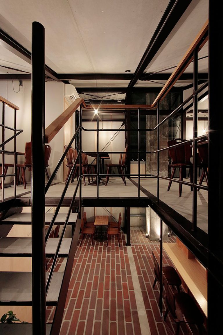 steel H-beams build coffee shop situated under railway elevated bridge ...