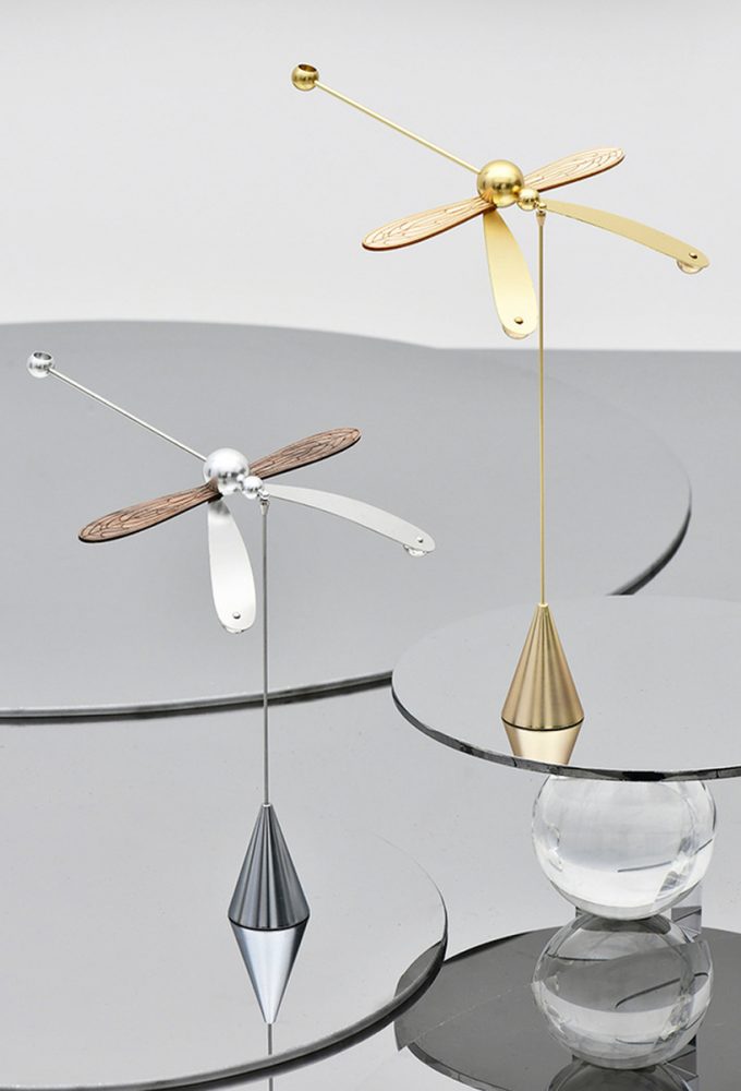 this dragonfly diffuser set balances on its beak while spreading gentle aromas