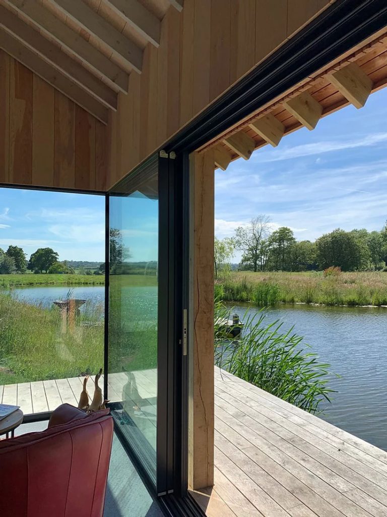 oak wood cladding + concrete details build lake cabin by RX architects ...