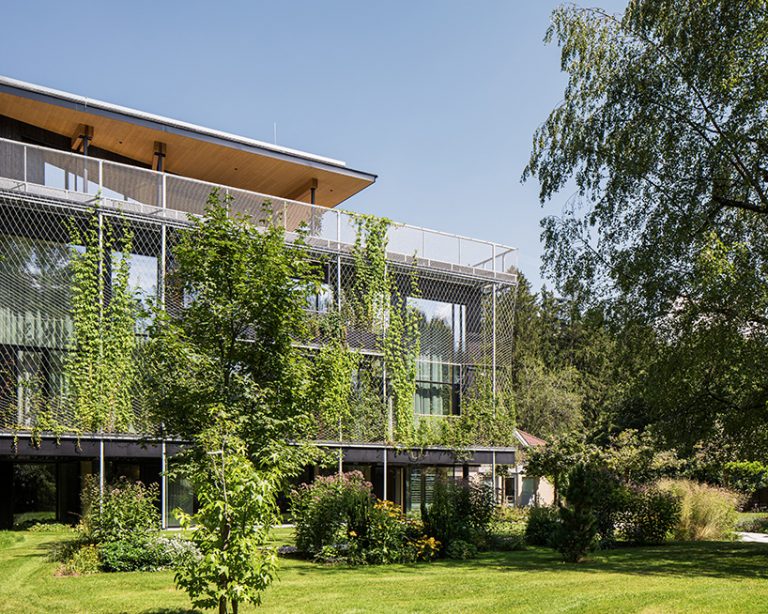 snøhetta wraps ASI reisen's timber office building with a 'green curtain'
