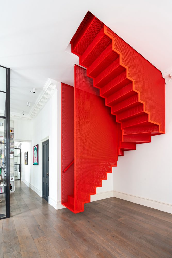 michaelis boyd intervenes georgian apartment with floating red staircase