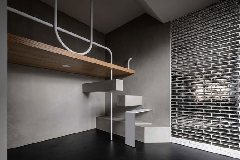 stainless steel wall reflects daily life within minimalist interior by ...