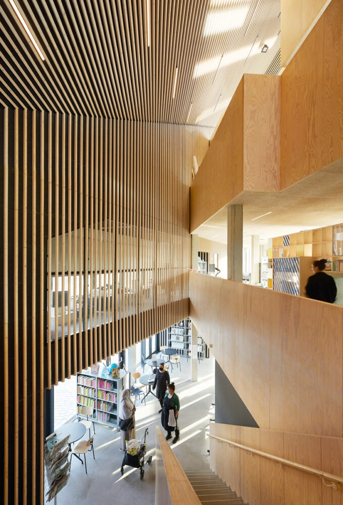hufton + crow captures COBE's wedge-shaped library in copenhagen