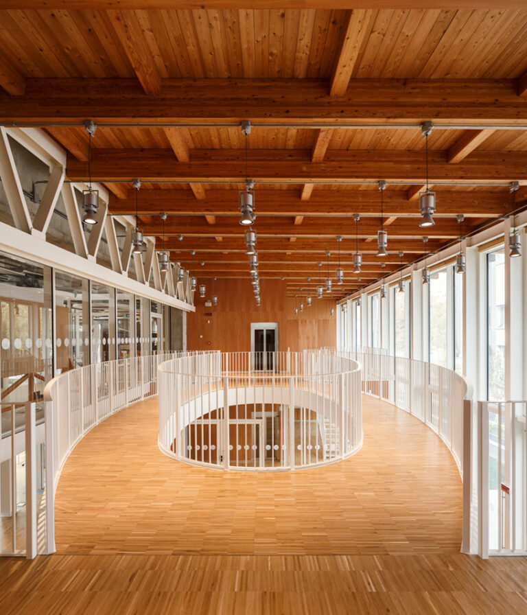 AMDL CIRCLE's Z-LIFE occupies a glass box within an industrial factory