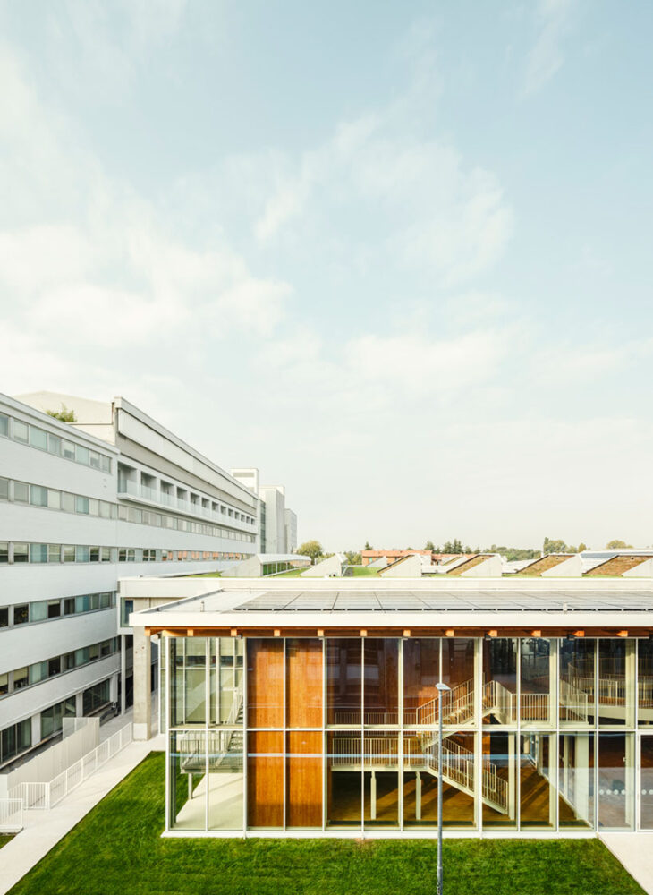 AMDL CIRCLE's Z-LIFE occupies a glass box within an industrial factory