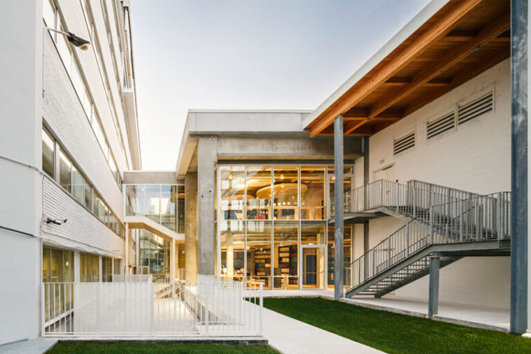 AMDL CIRCLE's Z-LIFE occupies a glass box within an industrial factory