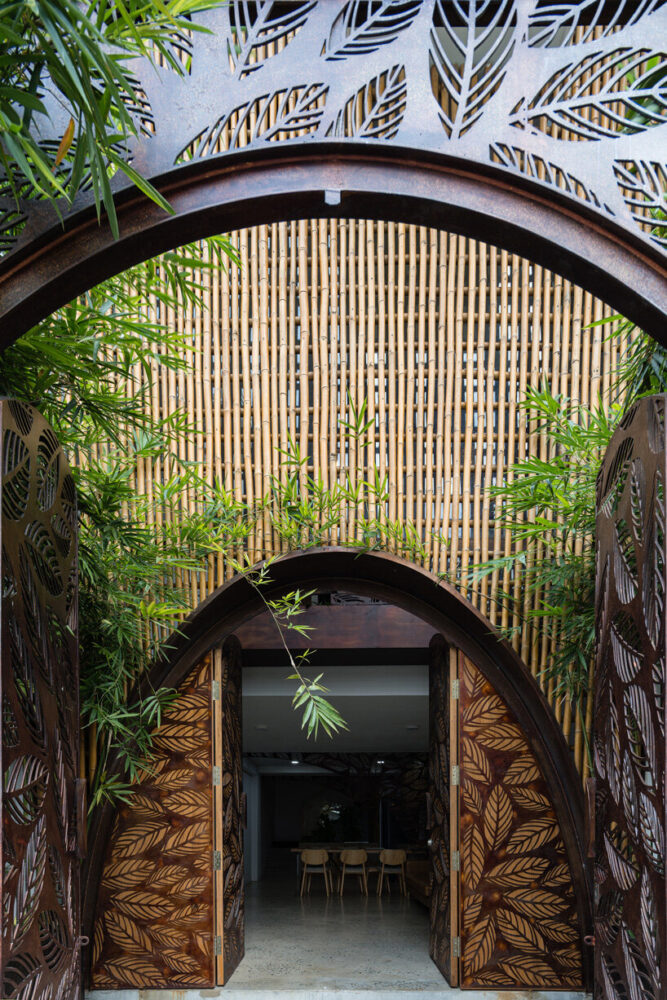 woven bamboo façade clads atelier ngng's 'floating nest' house in vietnam