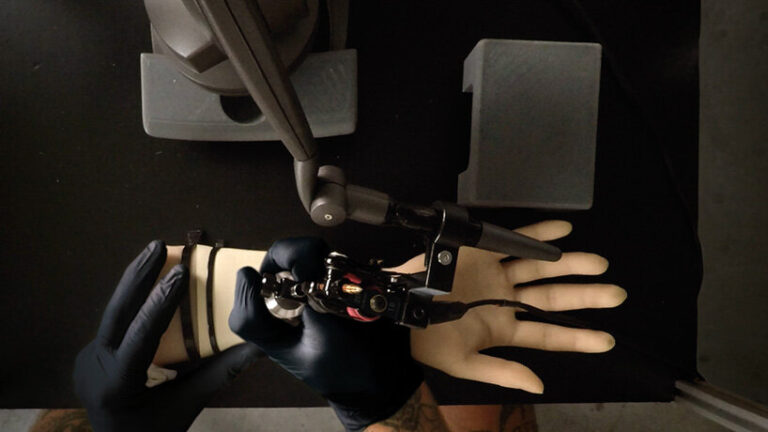 5G powered robot arm needles world's first ever remote tattoo