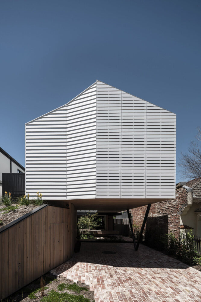 operable façade clads 'pop-up house' by figr architecture studio in ...